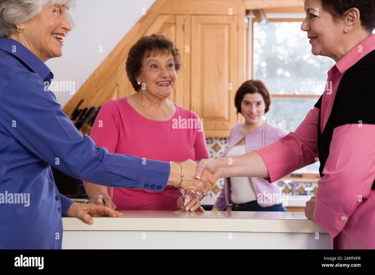 Women greeting each other Stock Photo - Alamy