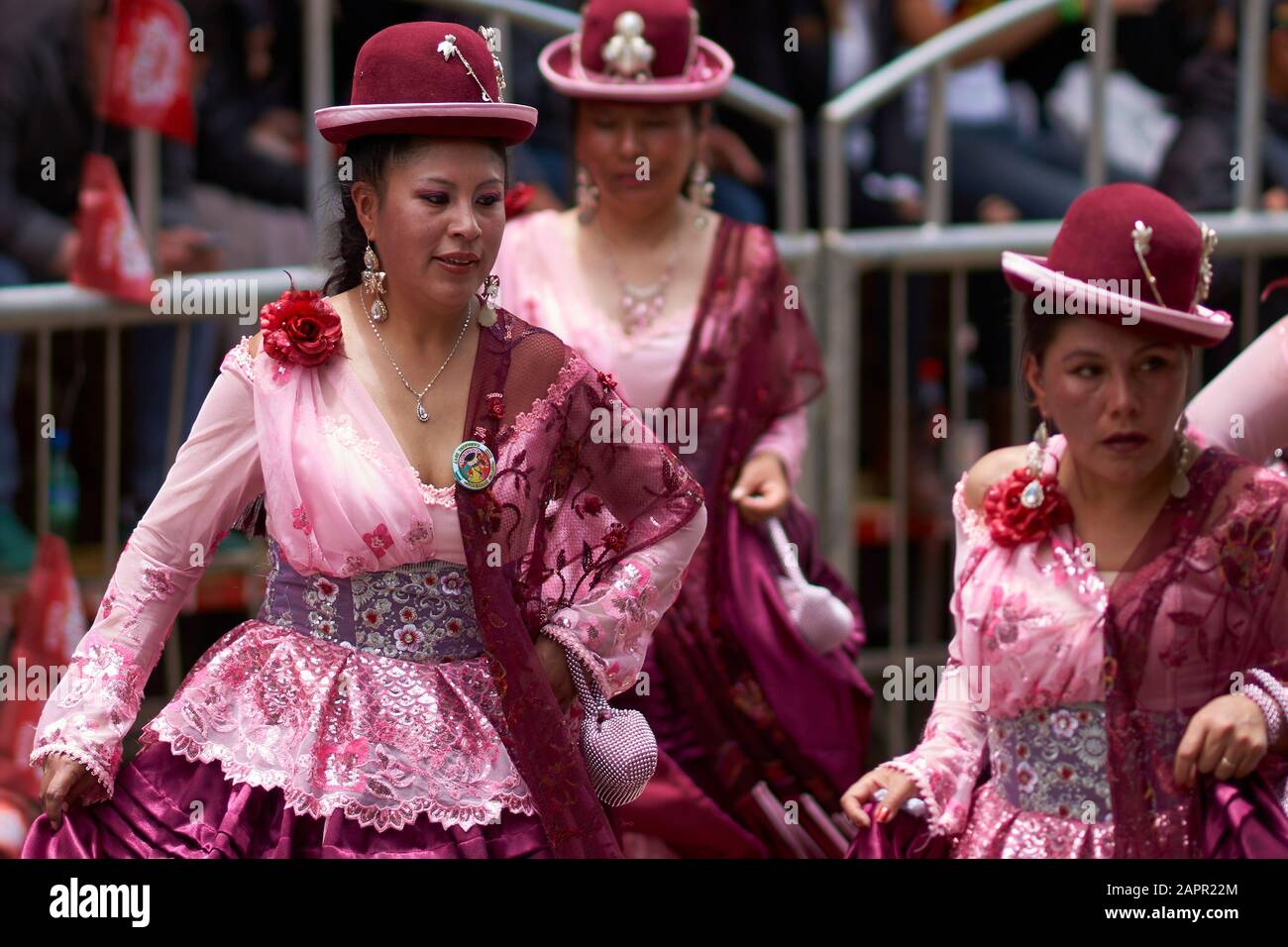 Morenada dance group in colourful outfits parading through the mining ...