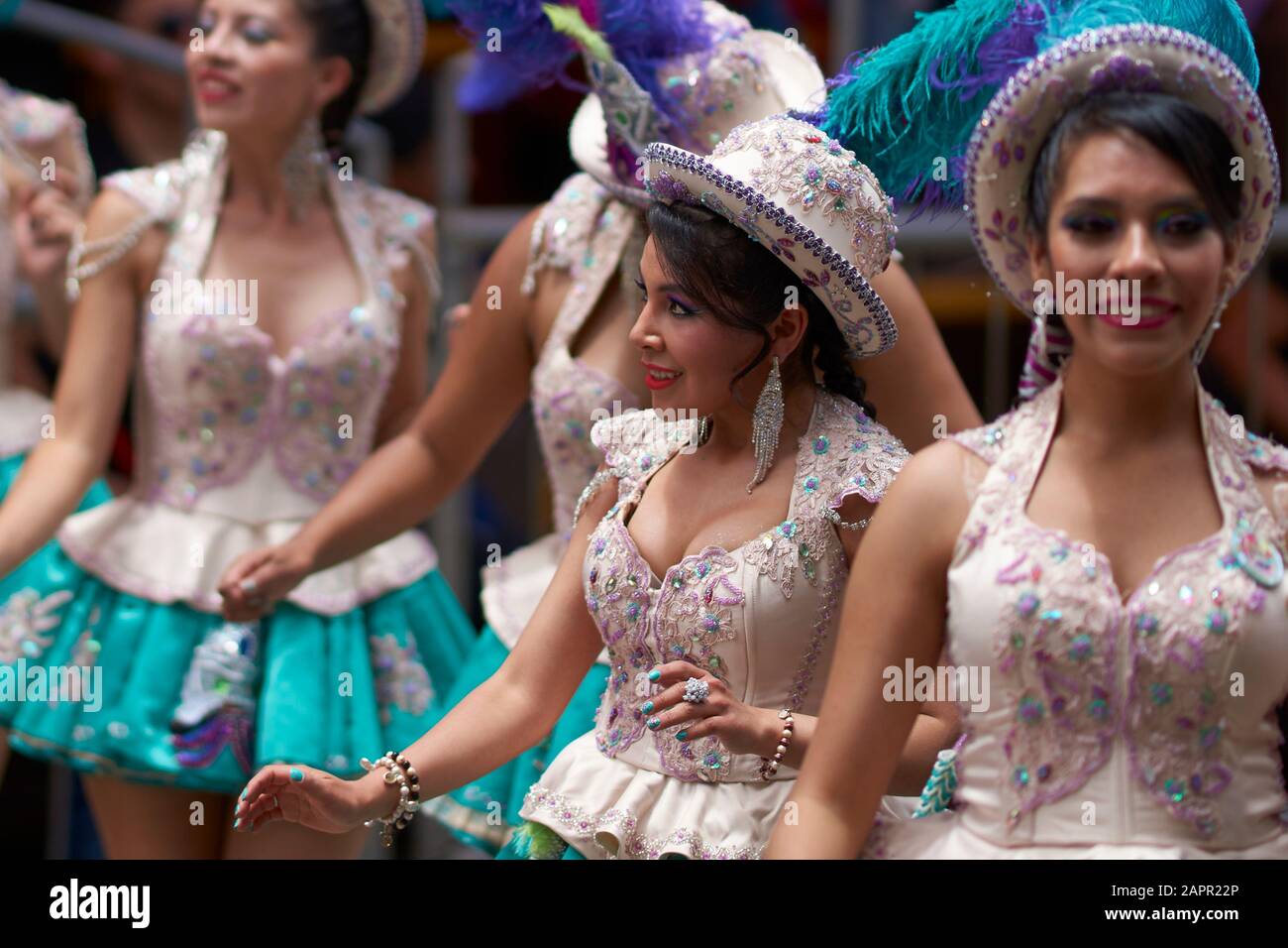Morenada dance group in colourful outfits parading through the mining ...