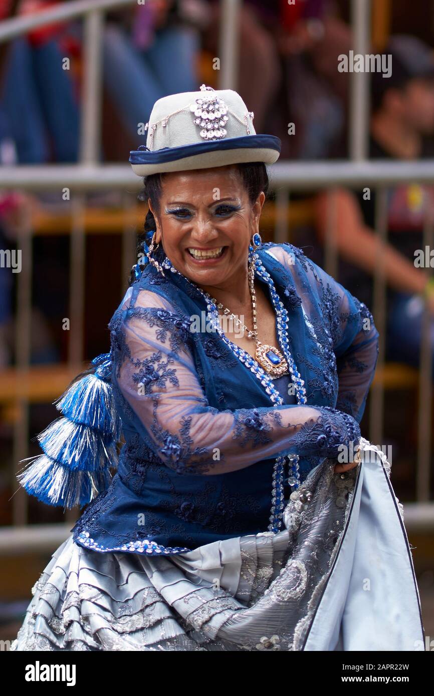 Morenada dance group in colourful outfits parading through the mining ...