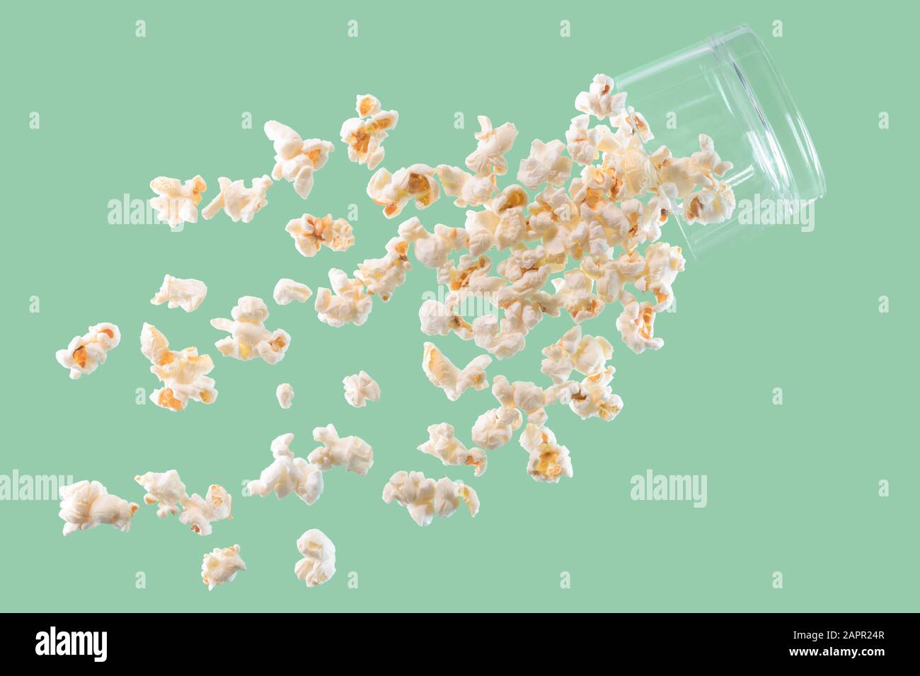 Delicious looking popcorn falling from a glass Stock Photo - Alamy