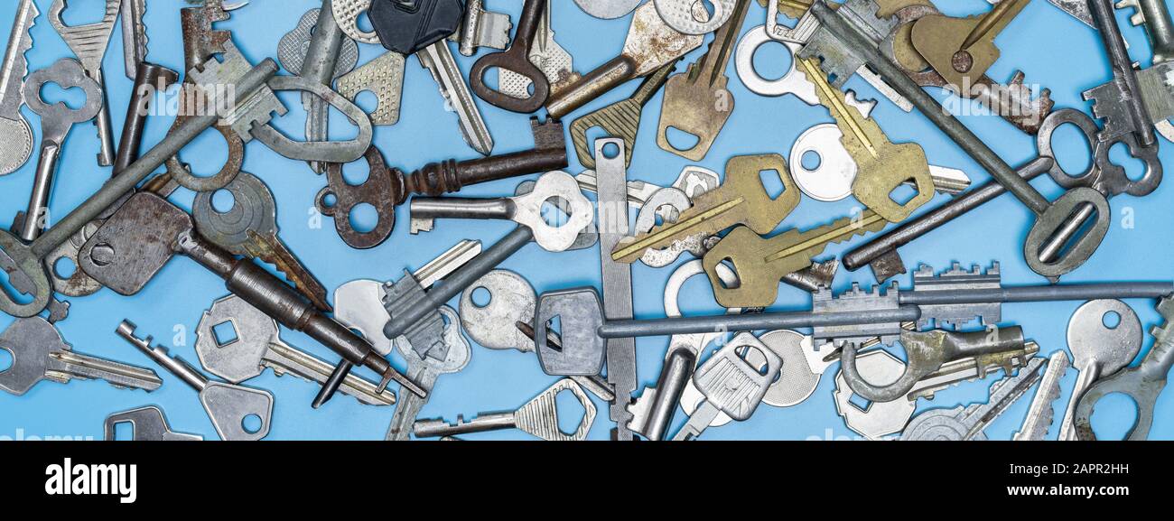 Keys set on blue background. Door lock keys and safes for property ...