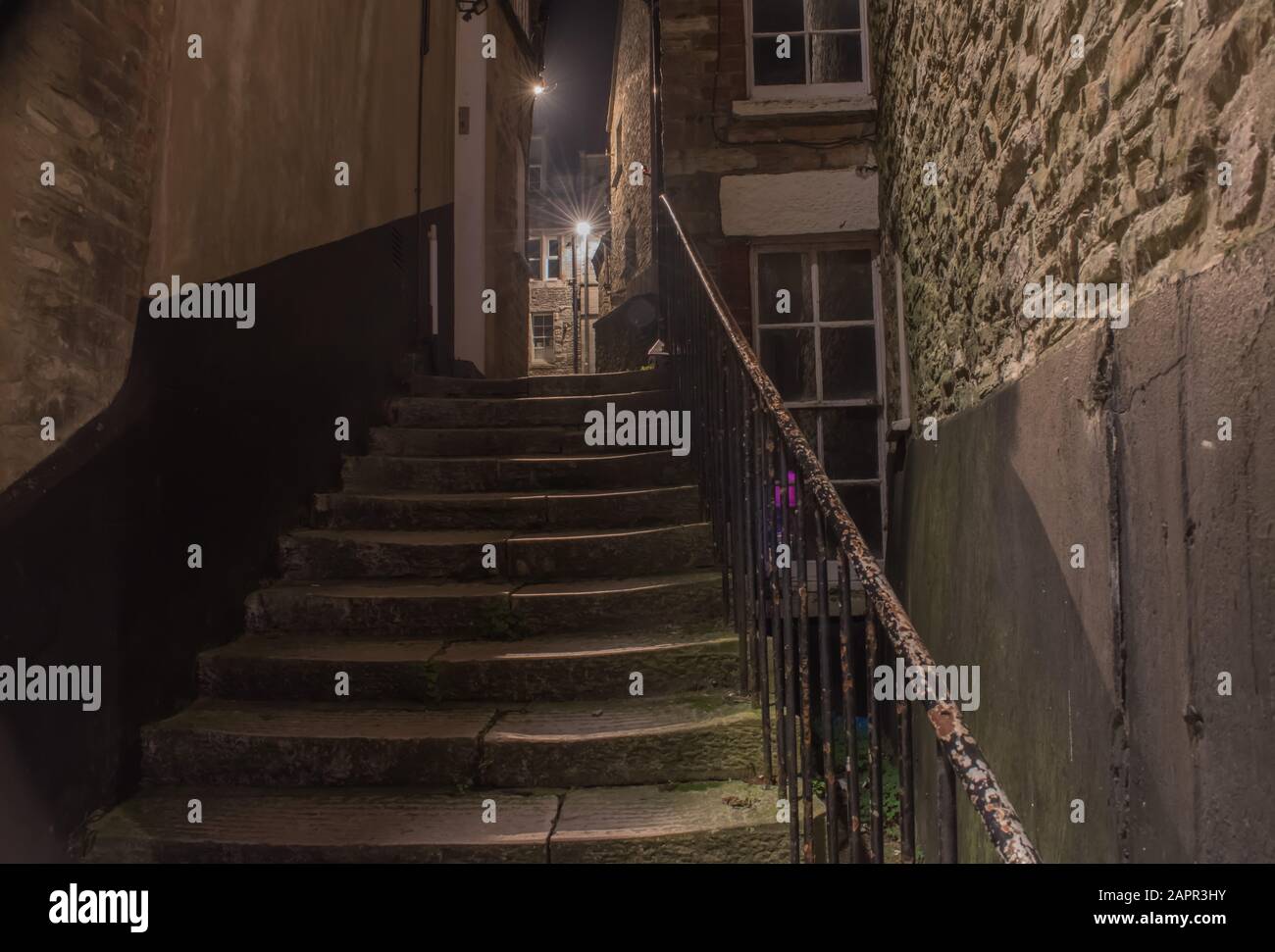 A night view up the well worn alleyway dimly lit passage steps Stock ...