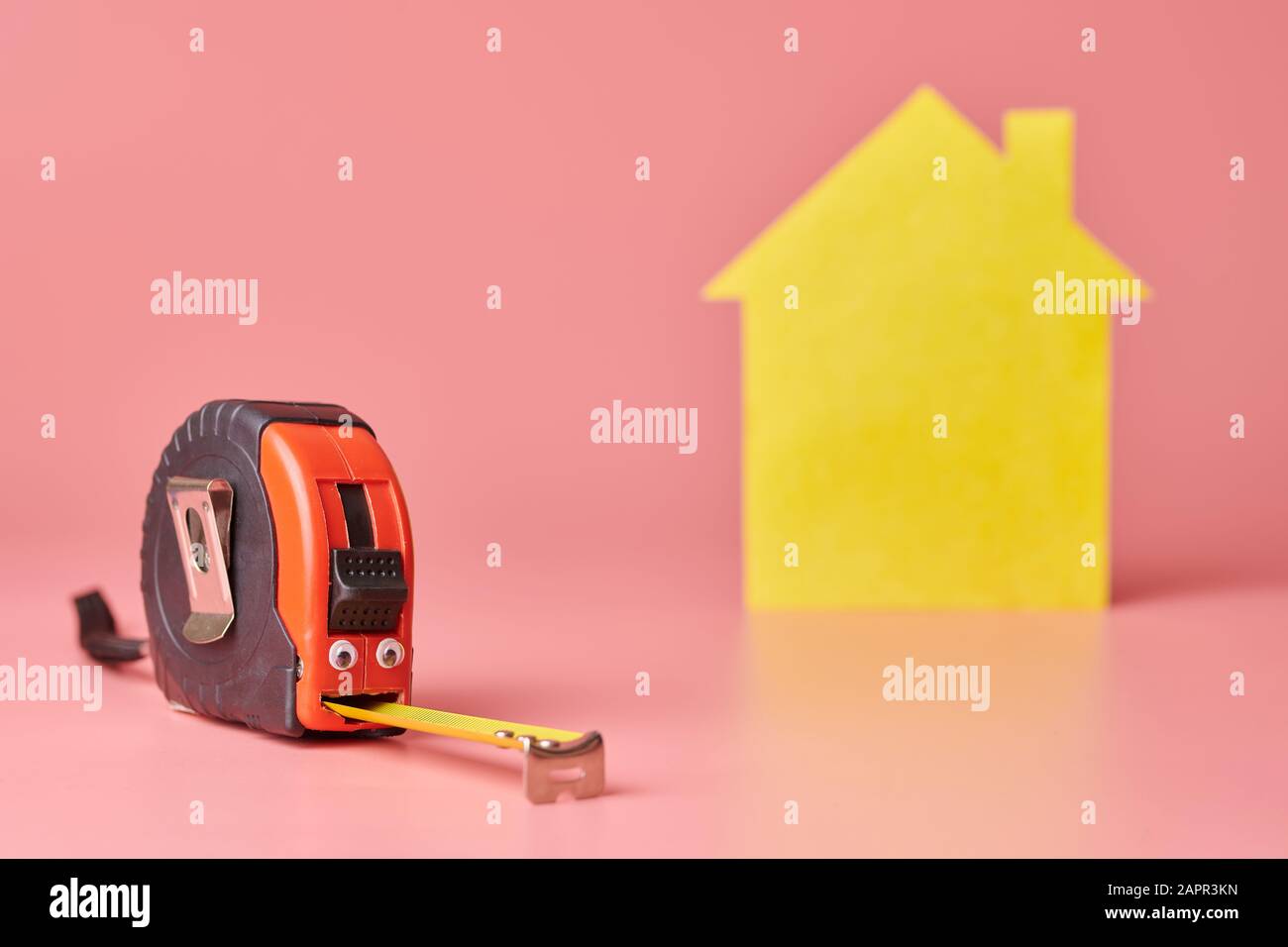 Metal tape measure funny concept. House renovation. Home repair and ...