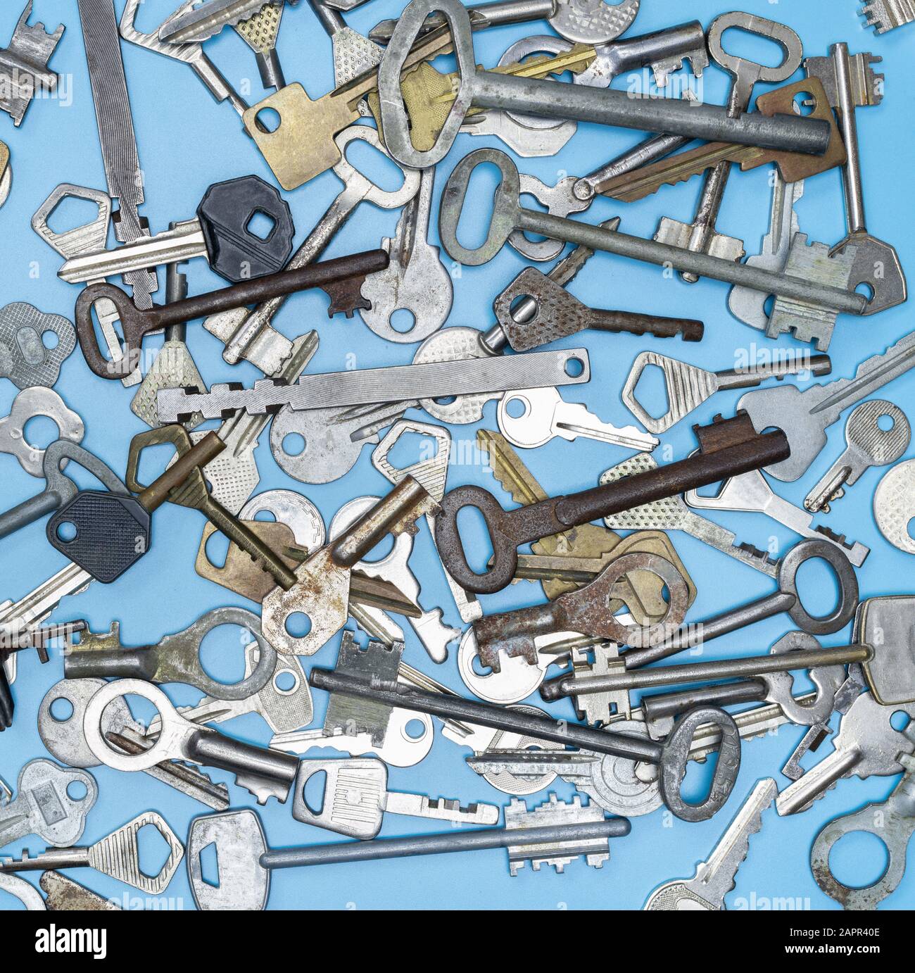 Keys set on blue background. Door lock keys and safes for property ...