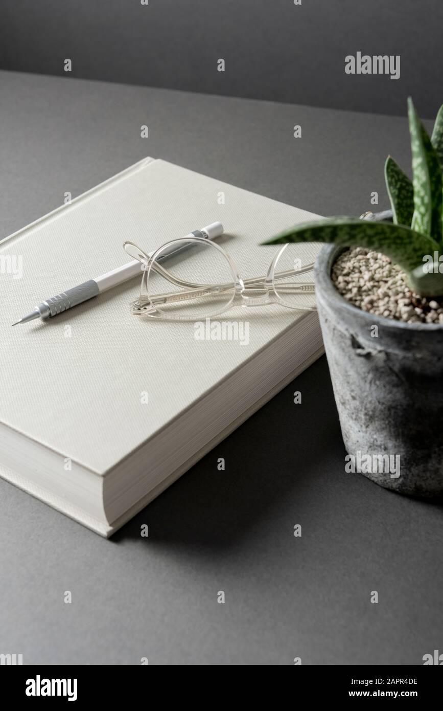 White diary on a grey desk Stock Photo - Alamy