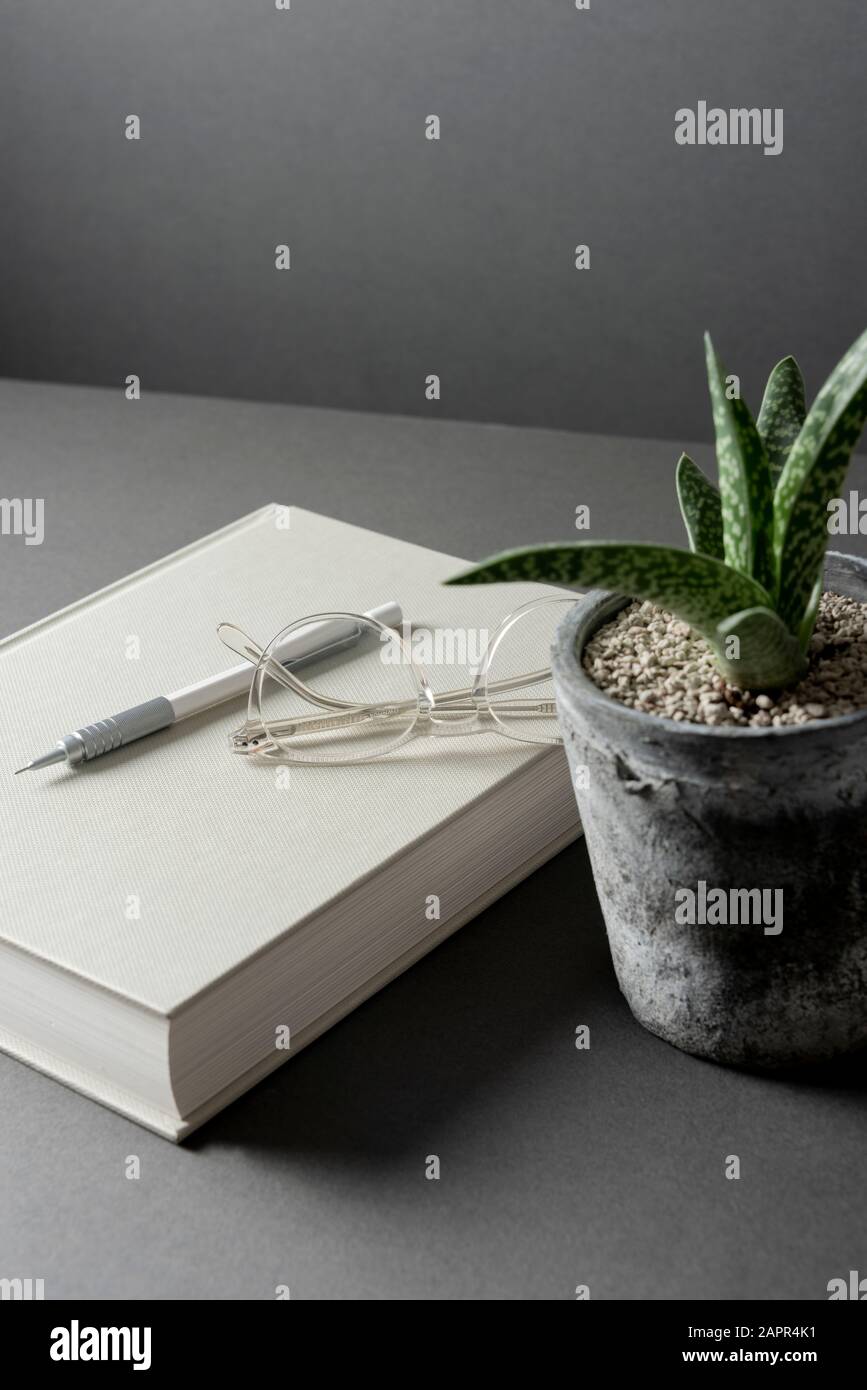 White diary on a grey desk Stock Photo - Alamy