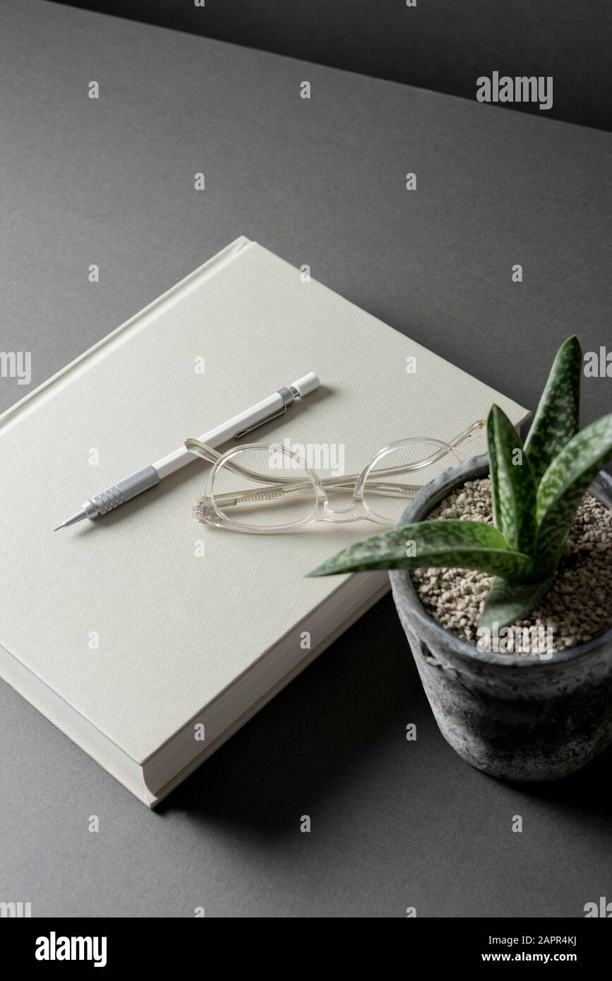 White diary on a grey desk Stock Photo - Alamy