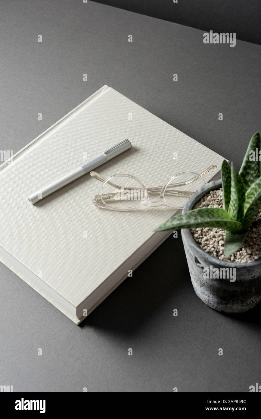 White diary on a grey desk Stock Photo - Alamy