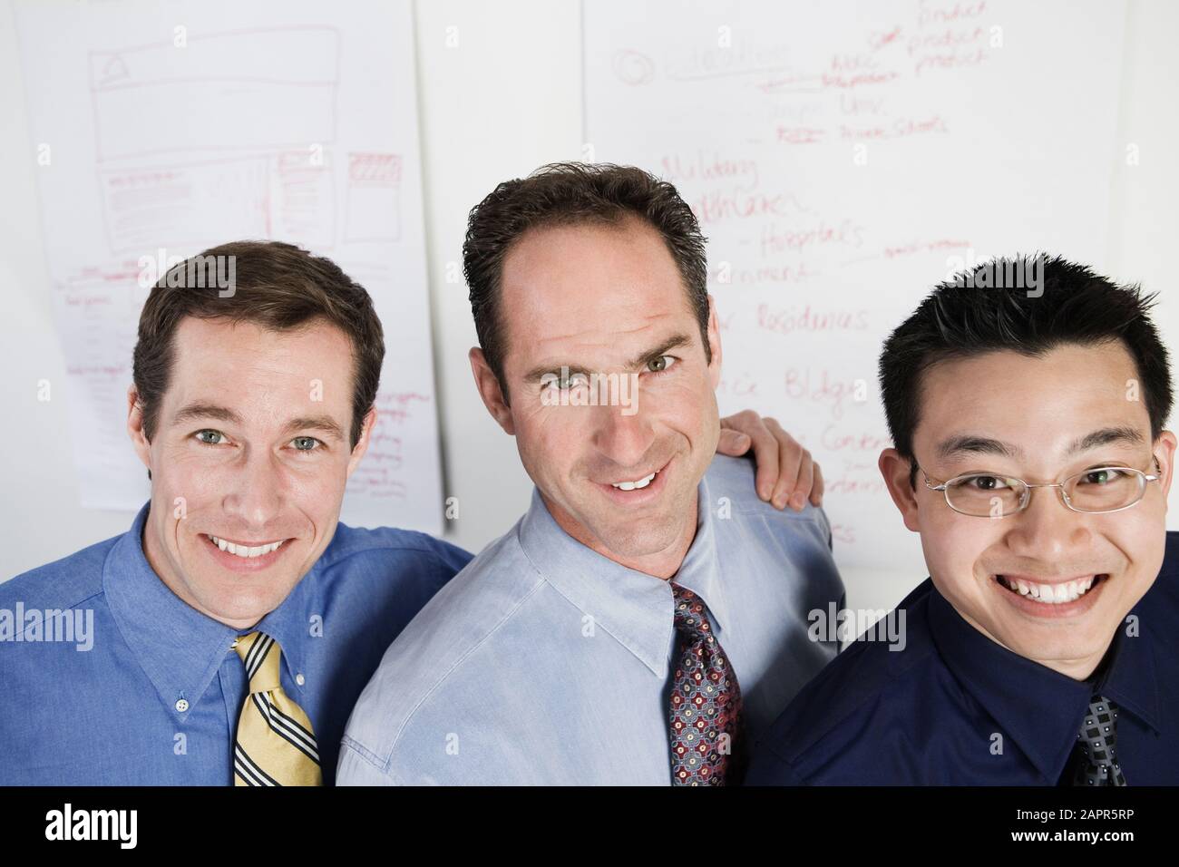 Content colleagues standing together hi-res stock photography and ...