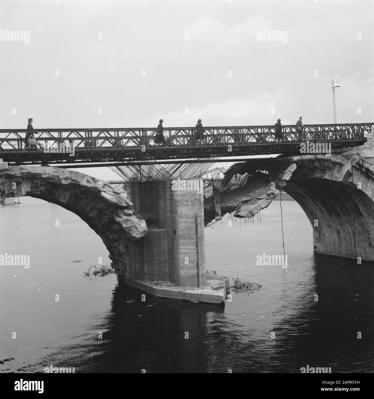 Emergency bridge built over the destroyed arches of the Sint ...