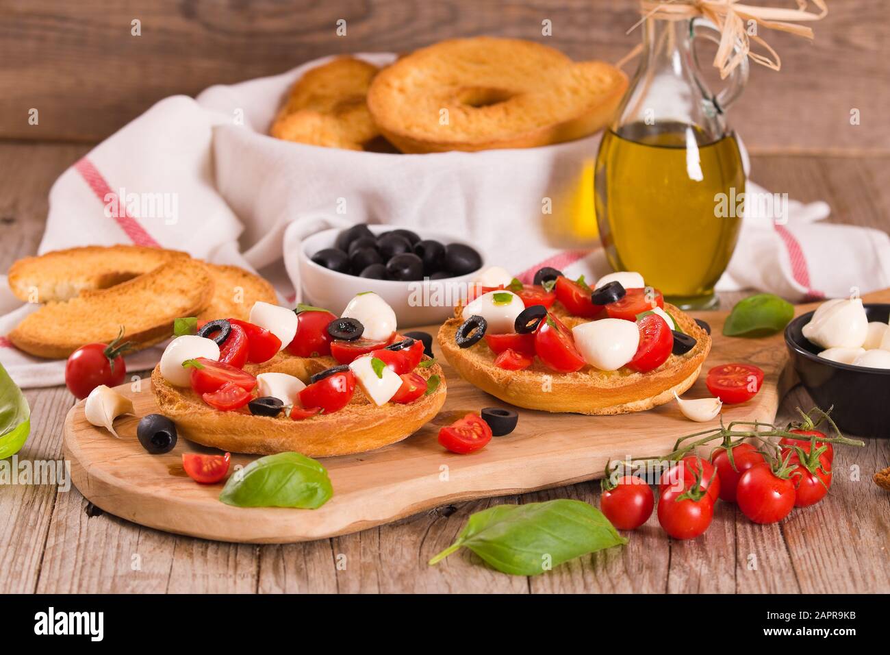 Friselle with tomatoes and mozzarella cheese Stock Photo - Alamy