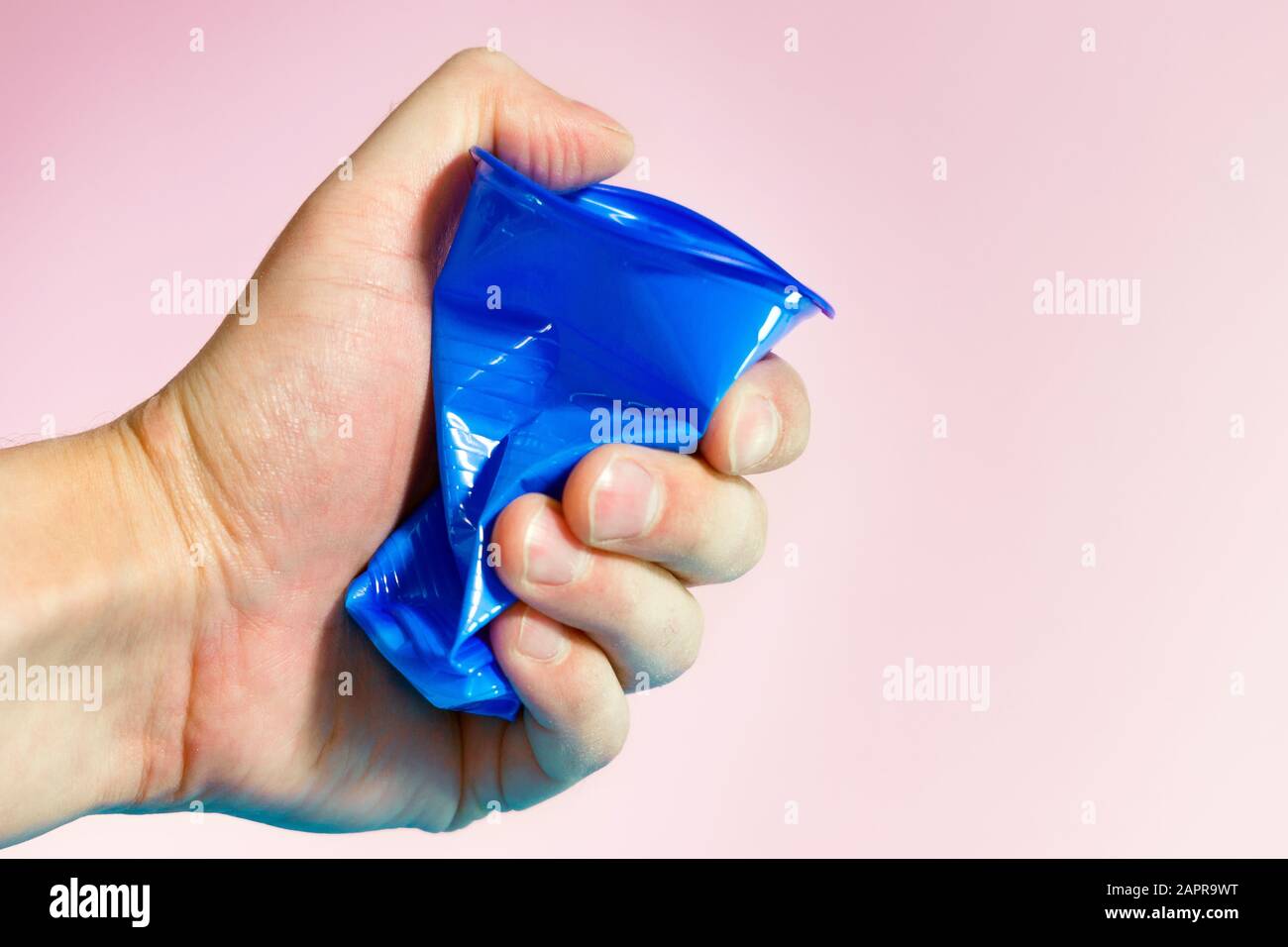 disposable plastic Cup in hand. the concept of failure from the plastic ...