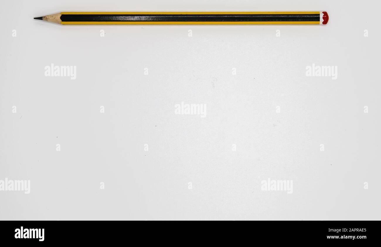 Isolated one single black and white lead pencil on top of blank white ...