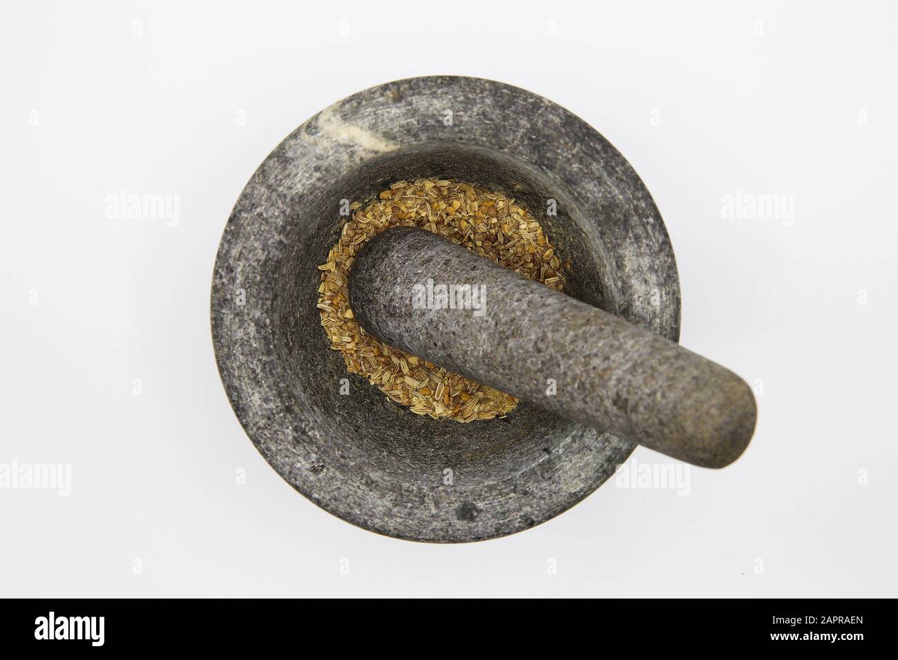 Top view close up on isolated gray basalt stone mortar with with pestle ...