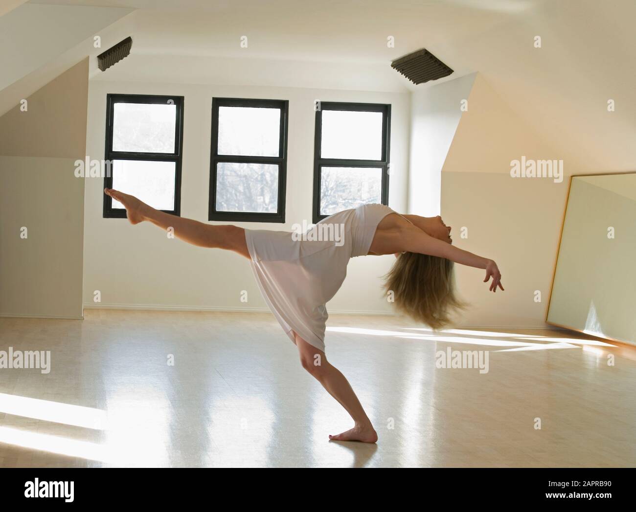 Side profile of a mid adult woman dancing Stock Photo - Alamy