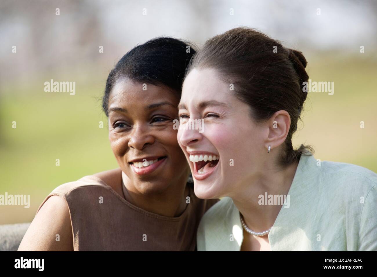 Close up of two women laughing Stock Photo - Alamy