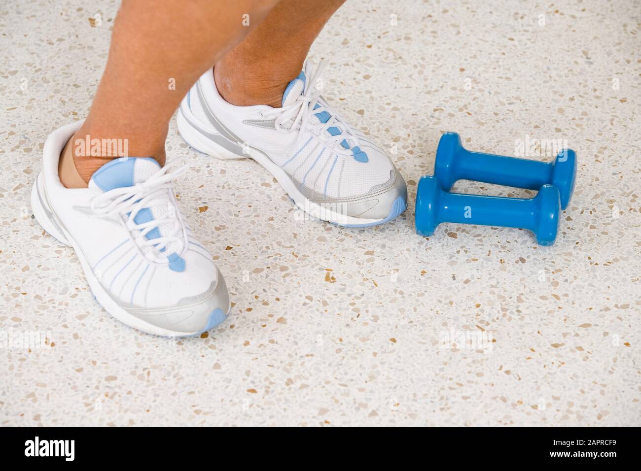 High angle view of a woman's leg with hand weights Stock Photo - Alamy