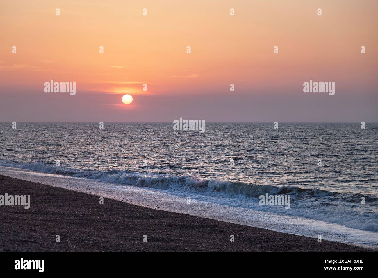 Setting sun on the Norfolk coastline, East Anglia UK Stock Photo - Alamy
