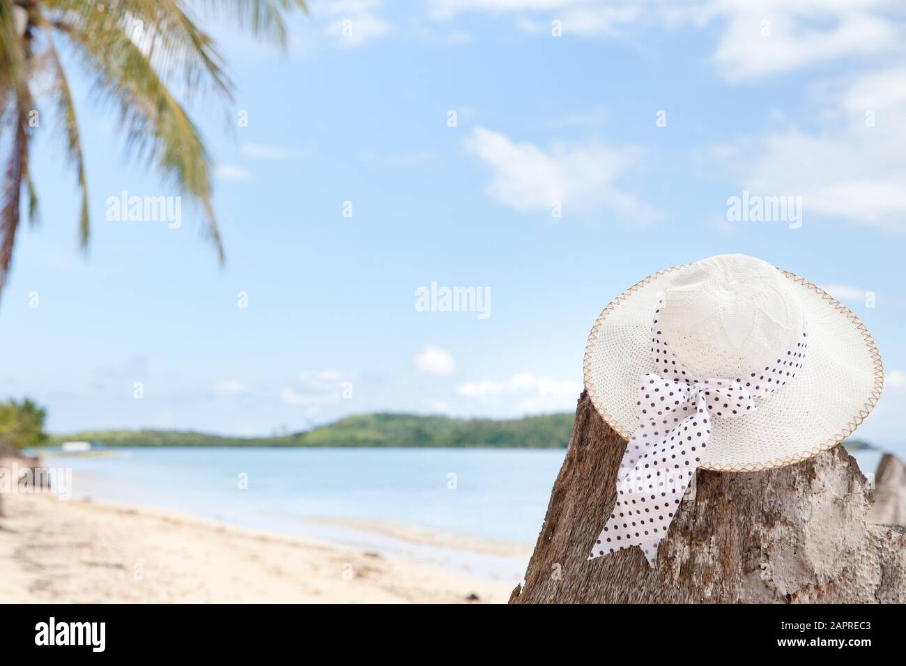 Hat on the beach. Beautiful hat on the beach, sun protection concept ...