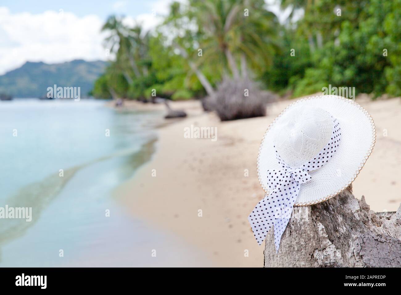 Hat on the beach. Beautiful hat on the beach, sun protection concept ...