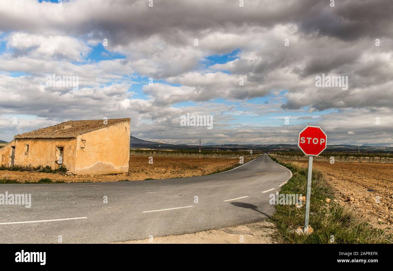Beautiful view of a freeway with an old house and a stop sign with a ...
