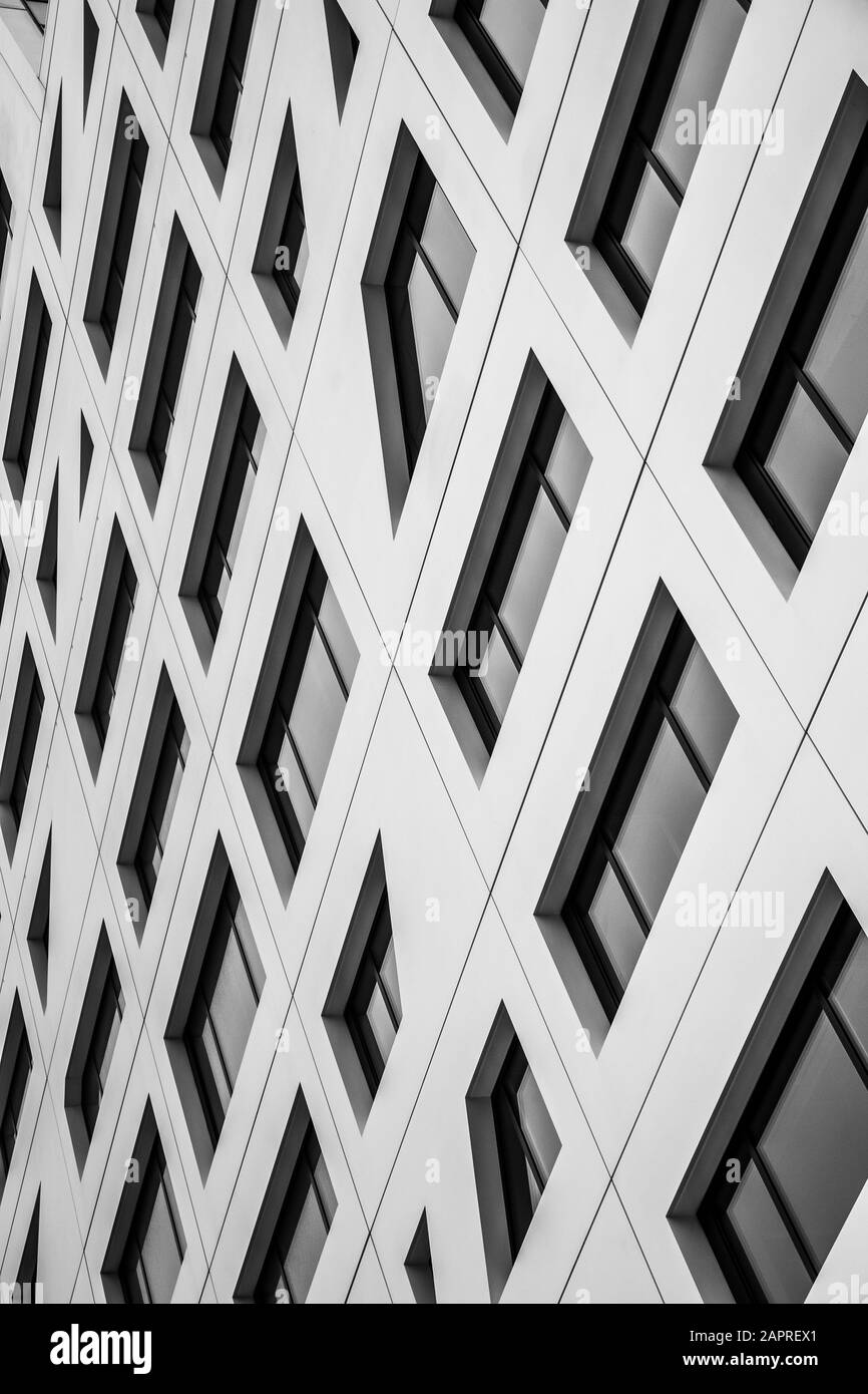 Low angle shot of the windows of a building with different shapes Stock ...
