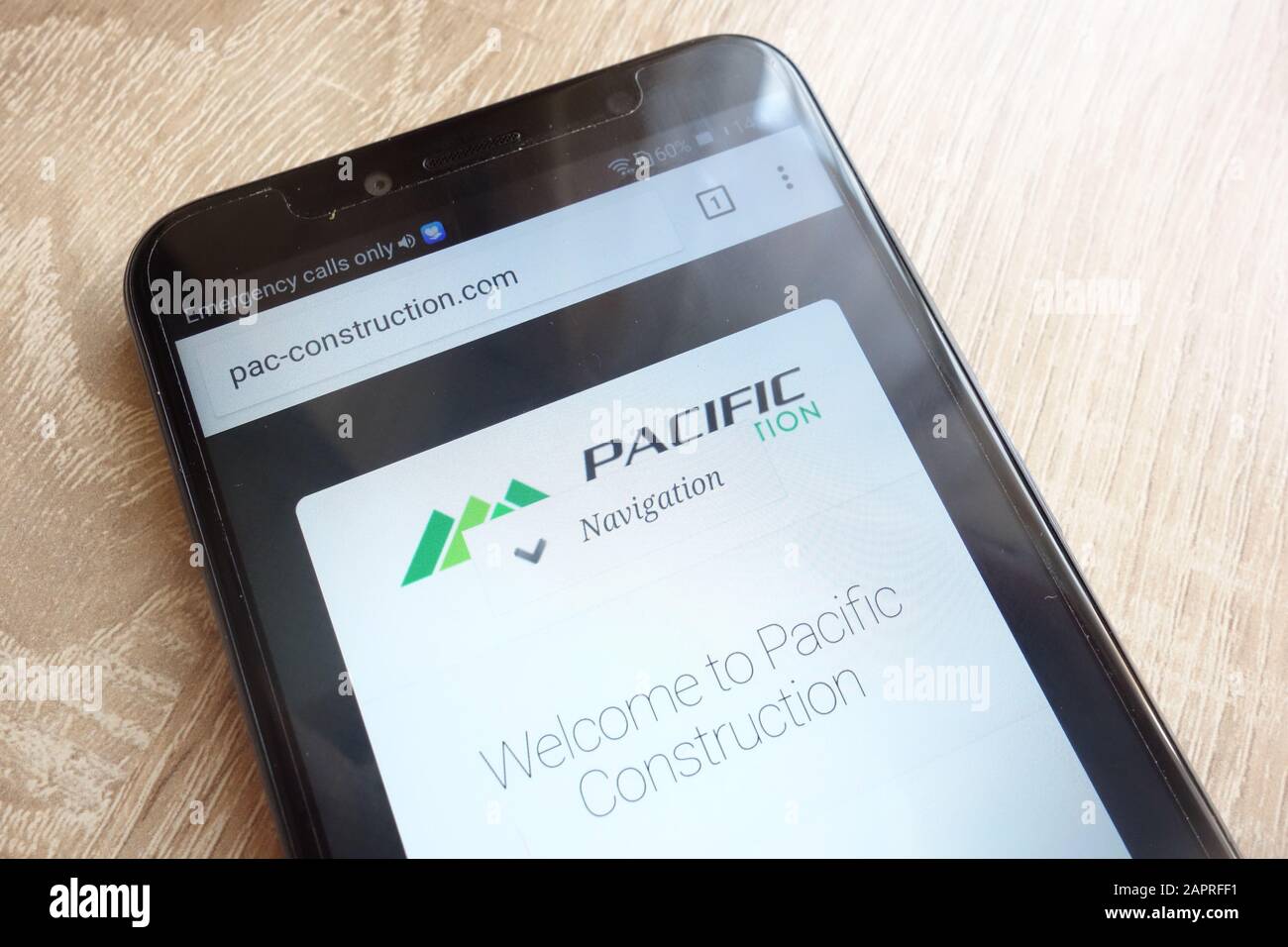 Pacific Construction Group website displayed on a modern smartphone ...