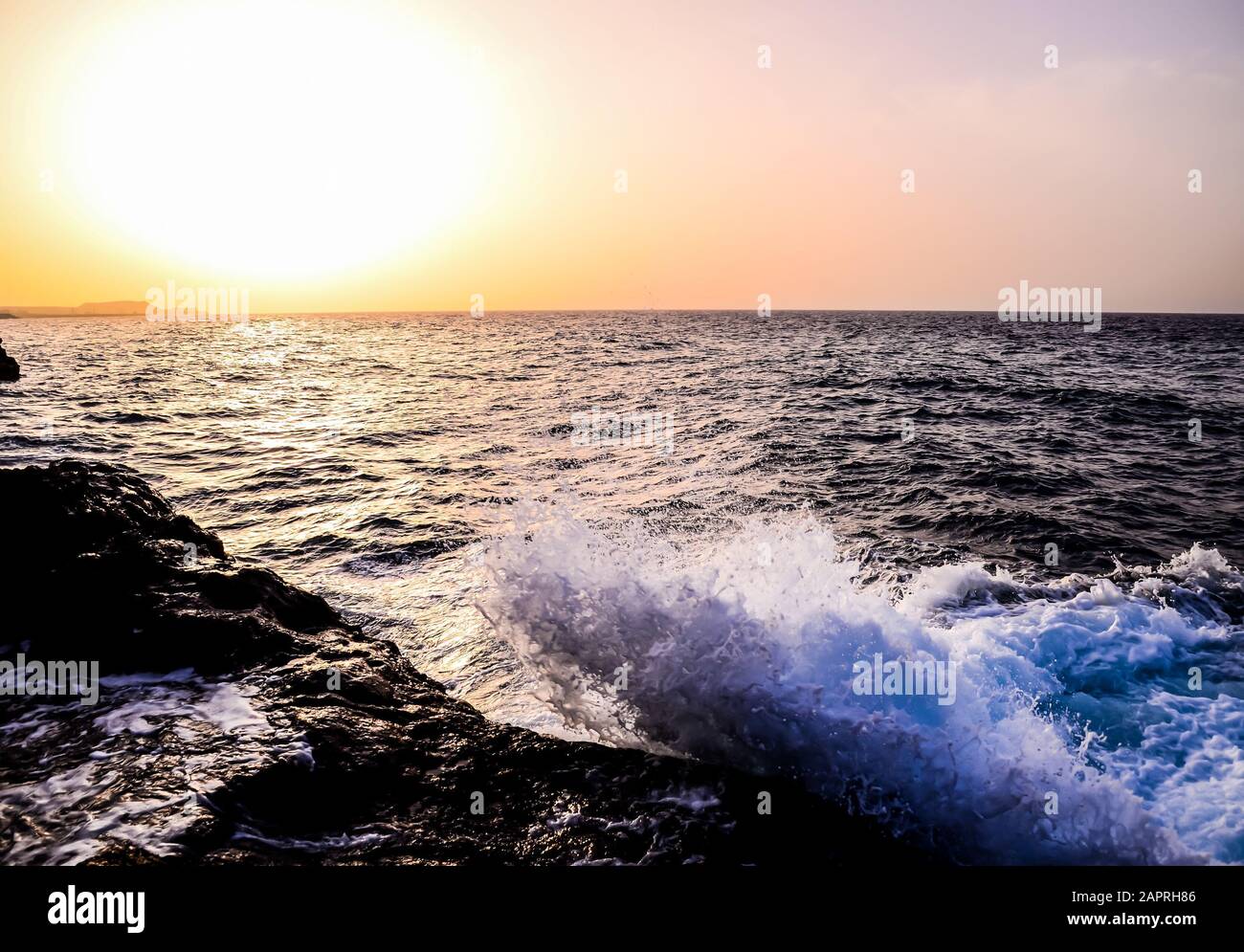 Landscape shot of a strong sea waves hitting very hard on the shore ...