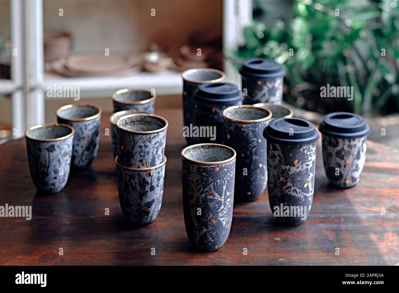 Decorative ceramic cups in the interior home. Showcase of handmade ...
