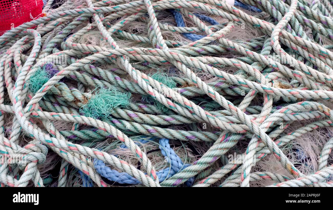 Pile of old frayed fishing rope and bits of net in Whitstable harbour ...