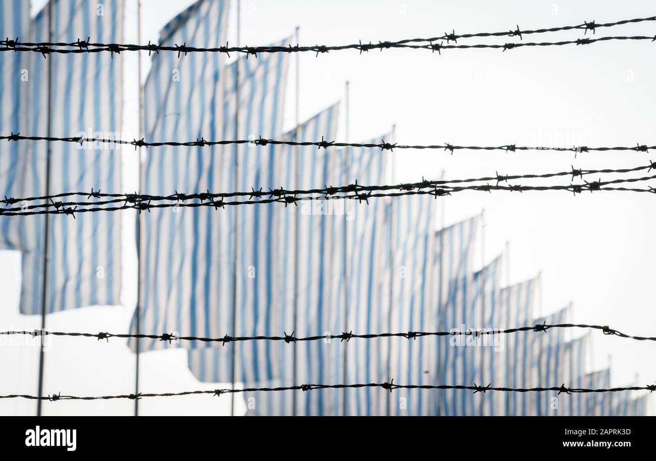 24 January 2020, Poland, Oswiecim: Behind the barbed wire of the former ...