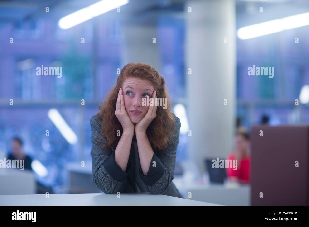 employee in an office thinking Stock Photo - Alamy