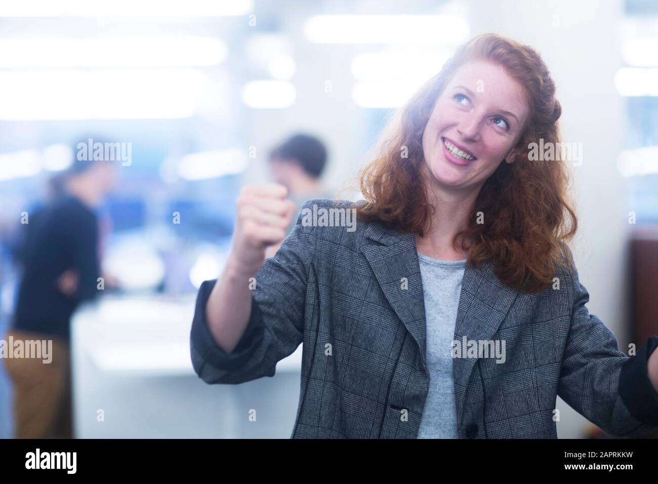 employee in an office excited and happy Stock Photo - Alamy