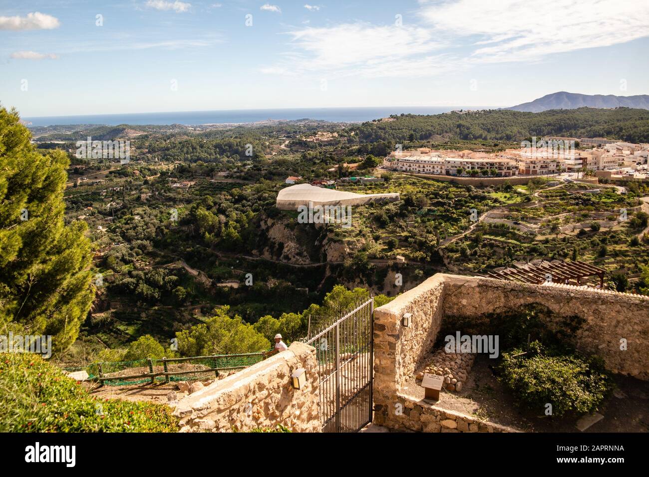 Bird's eye view of Polop city in Spain under a blue sly Stock Photo - Alamy