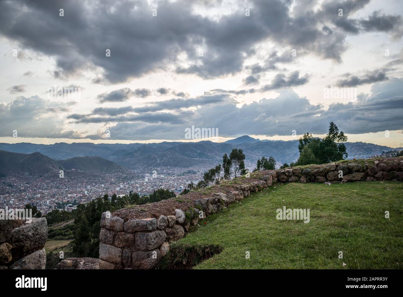 stone wall near city and mountains background Stock Photo - Alamy