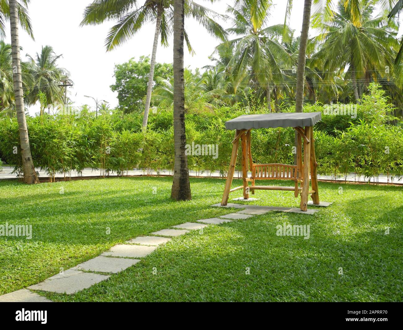 Wooden swing in the park, India, Tamil Nadu Stock Photo - Alamy