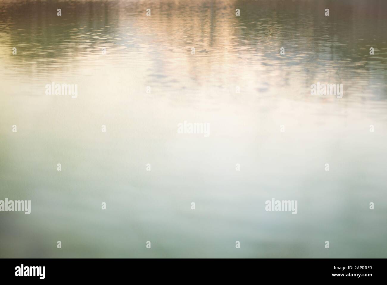 Blurry Photo Of Lake At Sunset Stock Photo - Alamy