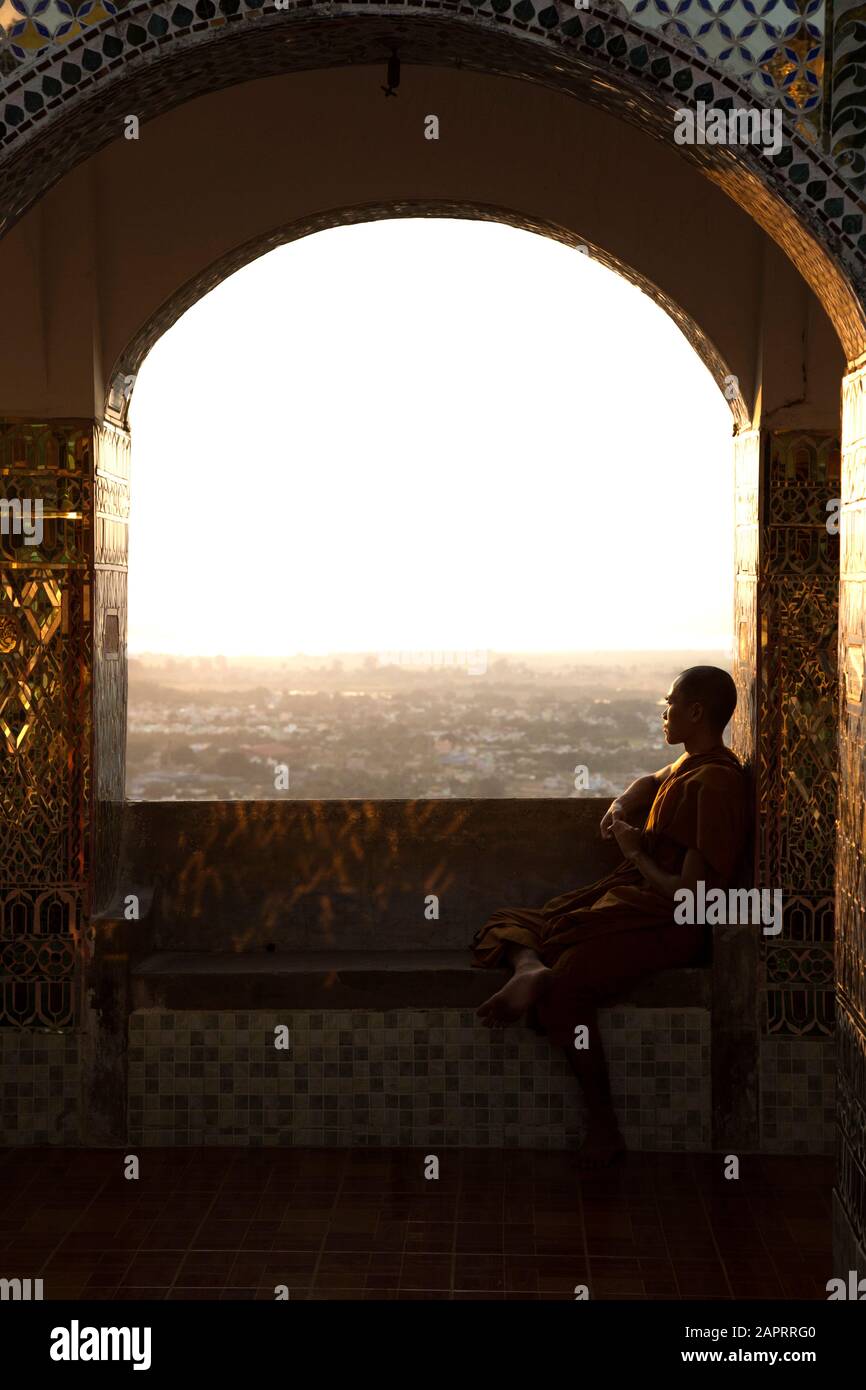 Buddhist monk looking at sunset hi-res stock photography and images - Alamy