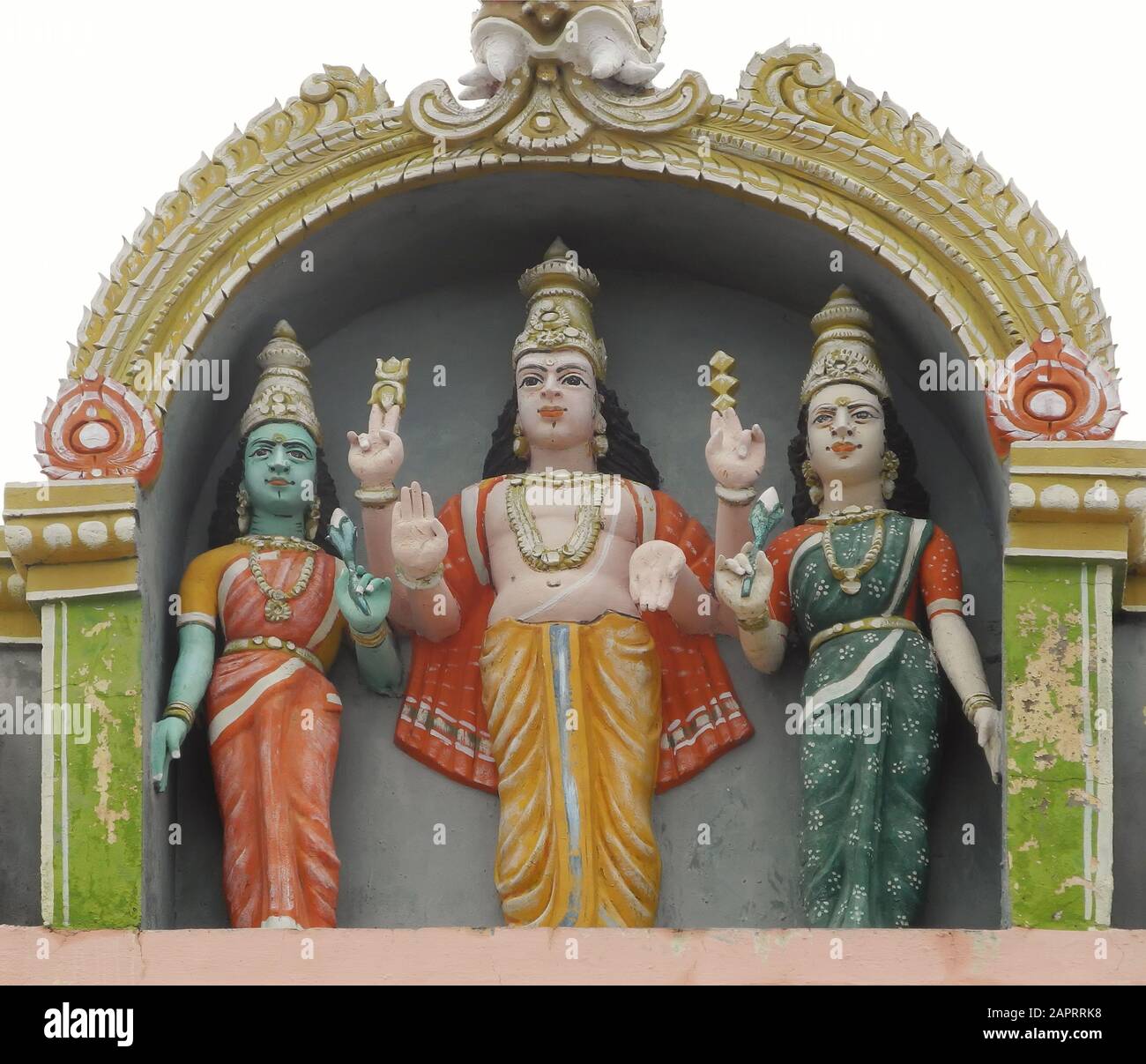 Statue of hindu god Murugan, brother of Ganesh, with two wives, India ...