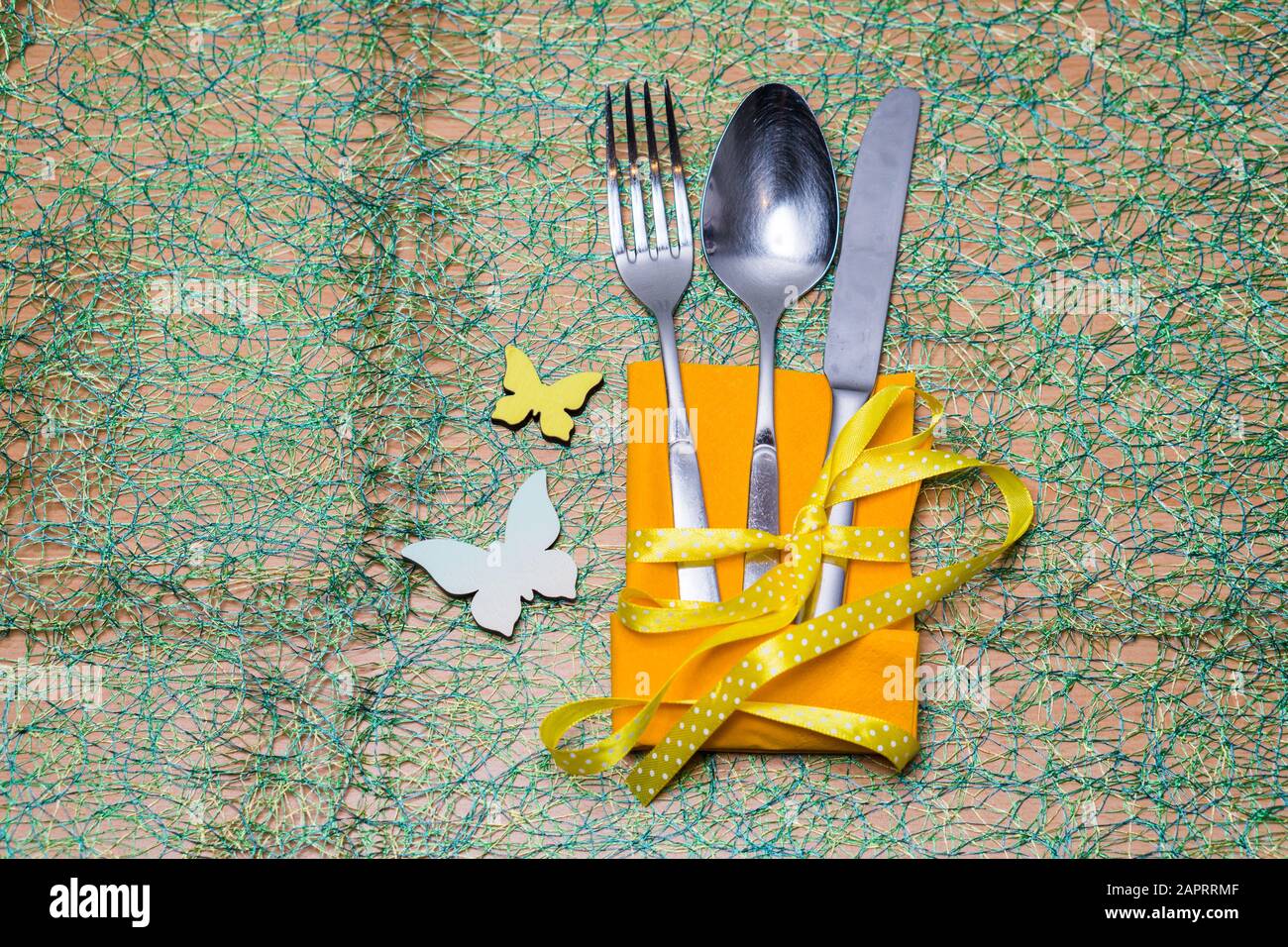 spring-like cutlery set with fork, knife and spoon Stock Photo - Alamy