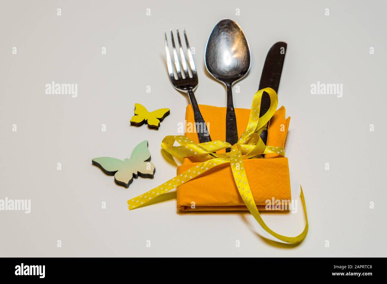 spring-like cutlery set with fork, knife and spoon Stock Photo - Alamy
