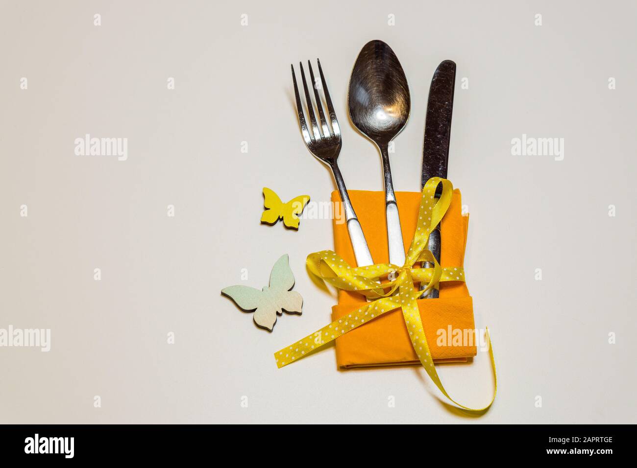 spring-like cutlery set with fork, knife and spoon Stock Photo - Alamy