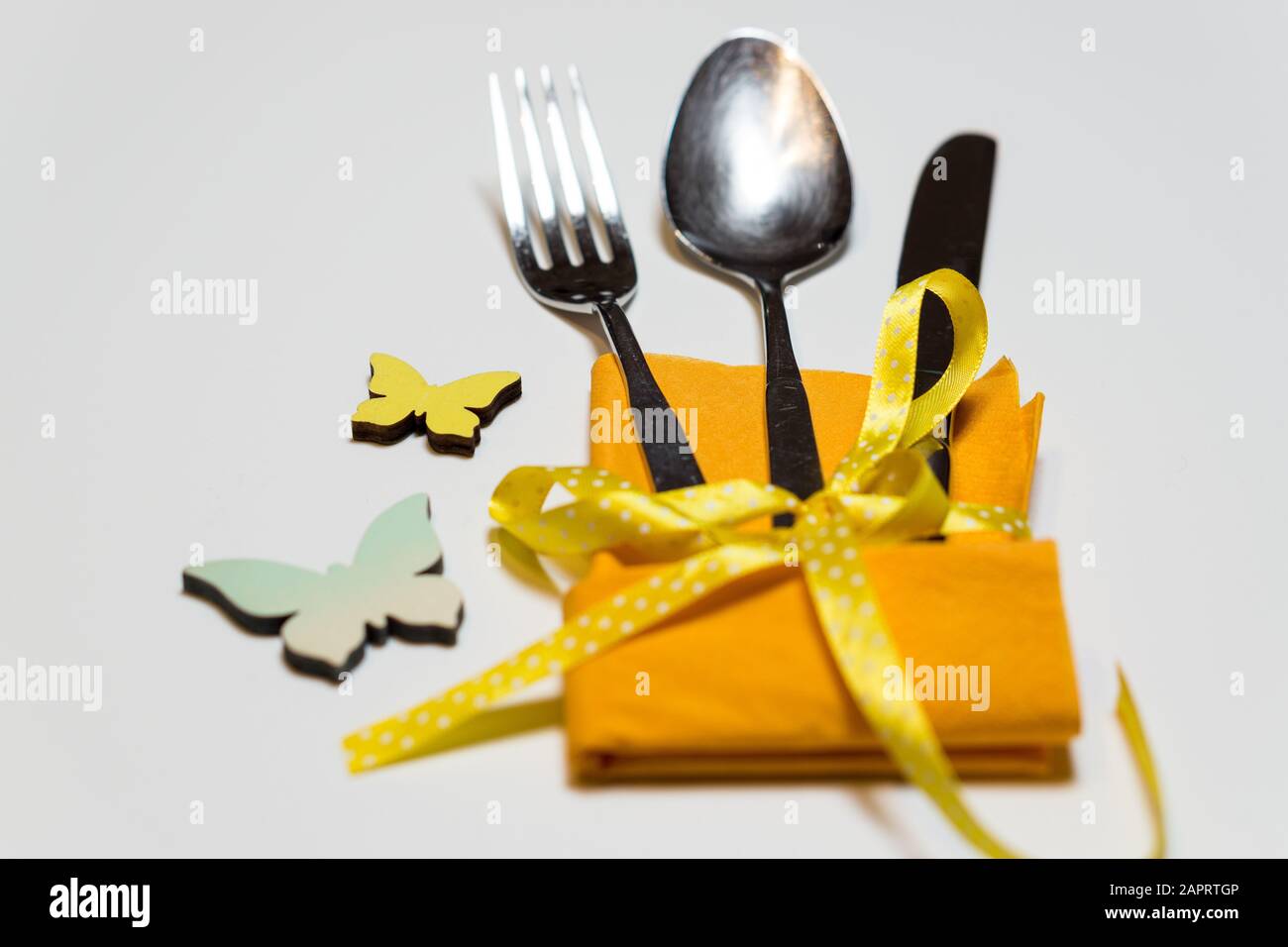 spring-like cutlery set with fork, knife and spoon Stock Photo - Alamy
