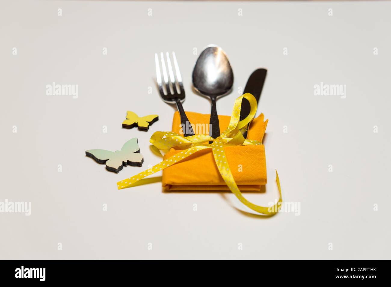 spring-like cutlery set with fork, knife and spoon Stock Photo - Alamy