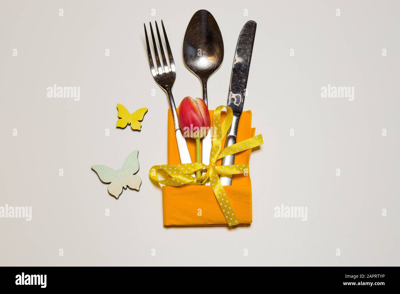 spring-like cutlery set with fork, knife and spoon Stock Photo - Alamy