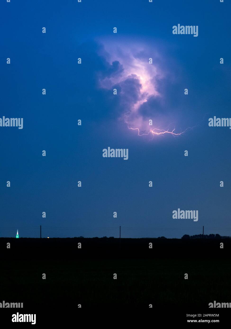 Lightning in the top of a thunderstorm Stock Photo - Alamy