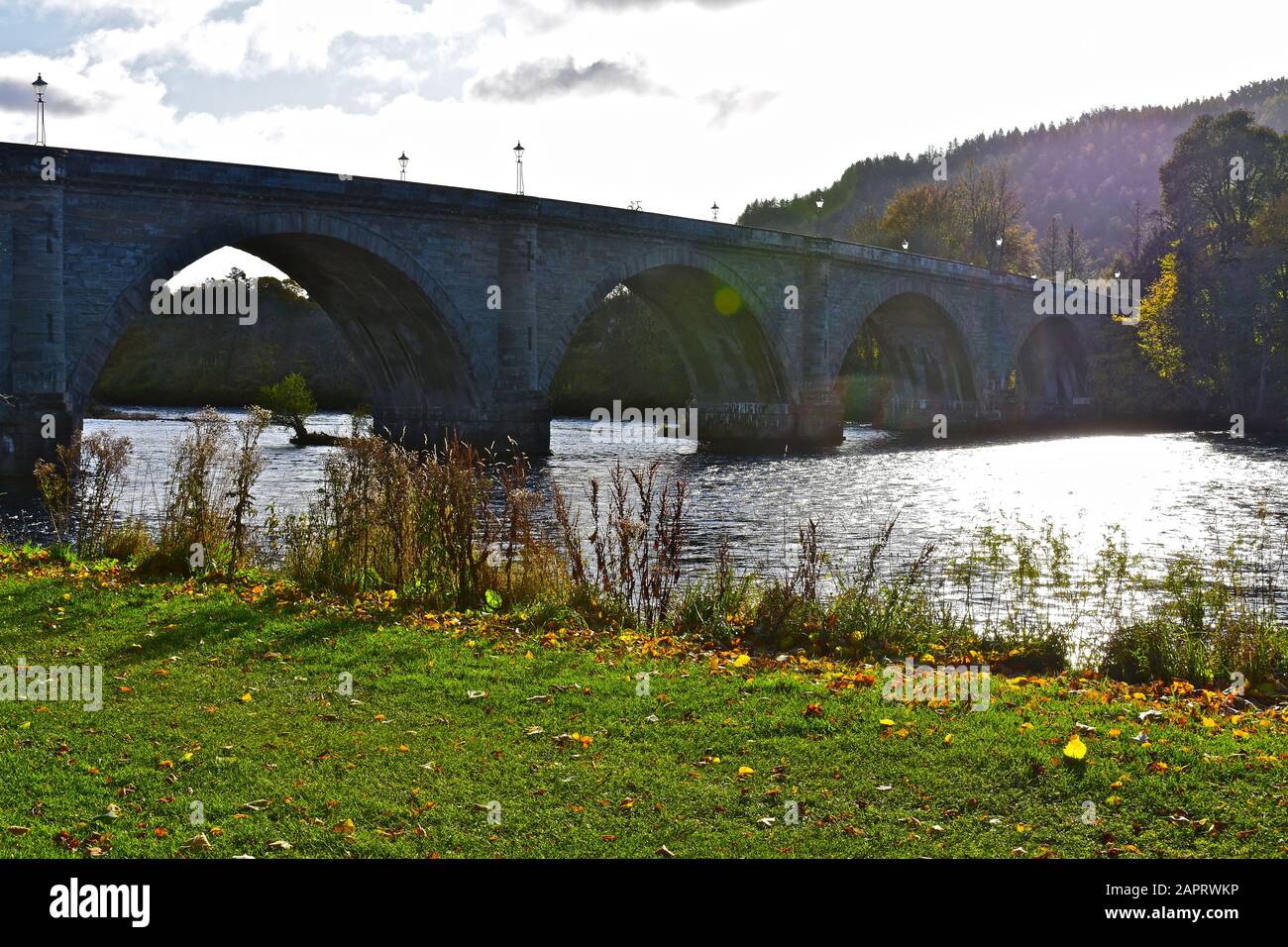 An autumn view from the north bank of the river Tay, of the old stone ...