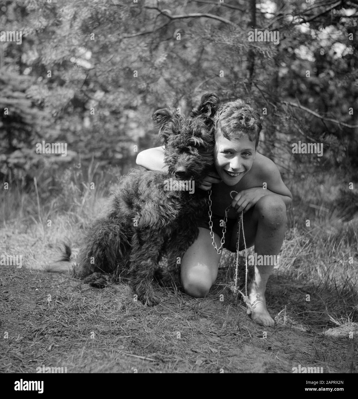 Family photos A boy with a dog Annotation: Note: John Date: undated ...