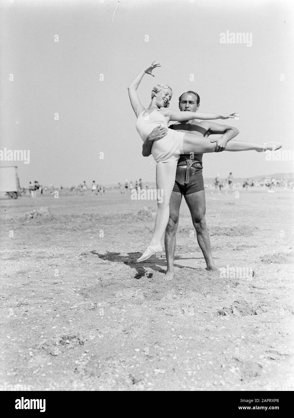 Beach people man woman Black and White Stock Photos & Images - Alamy